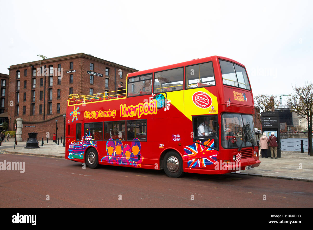 Sightseeing bus in Liverpool Albert dock UK Stock Photo - Alamy