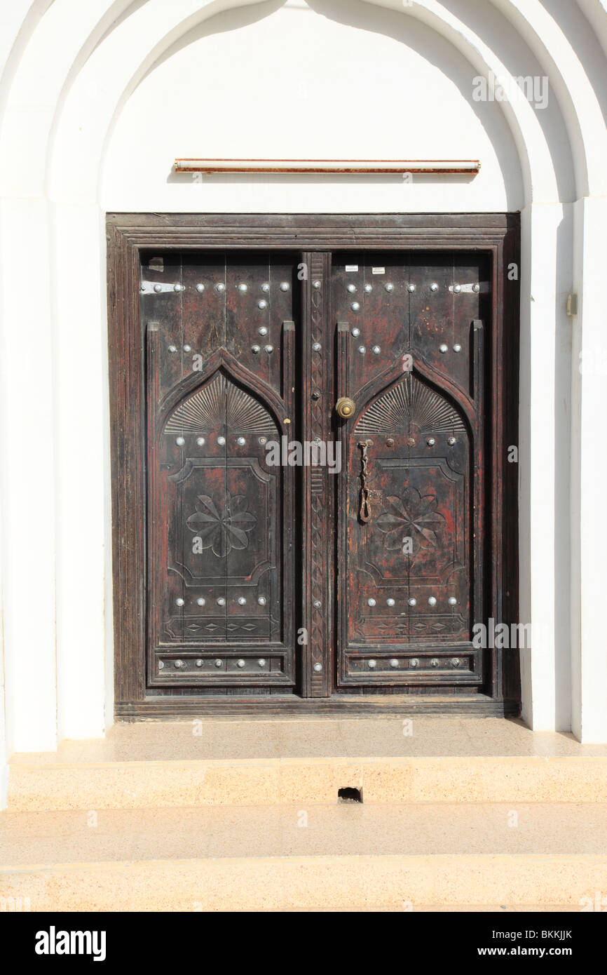 traditional wooden door in the village of Sur, Sultanate of Oman. Photo ...