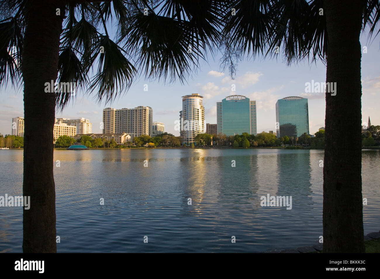 Modern architecture skyline of Orlando Florida reflecting in Lake Eola ...