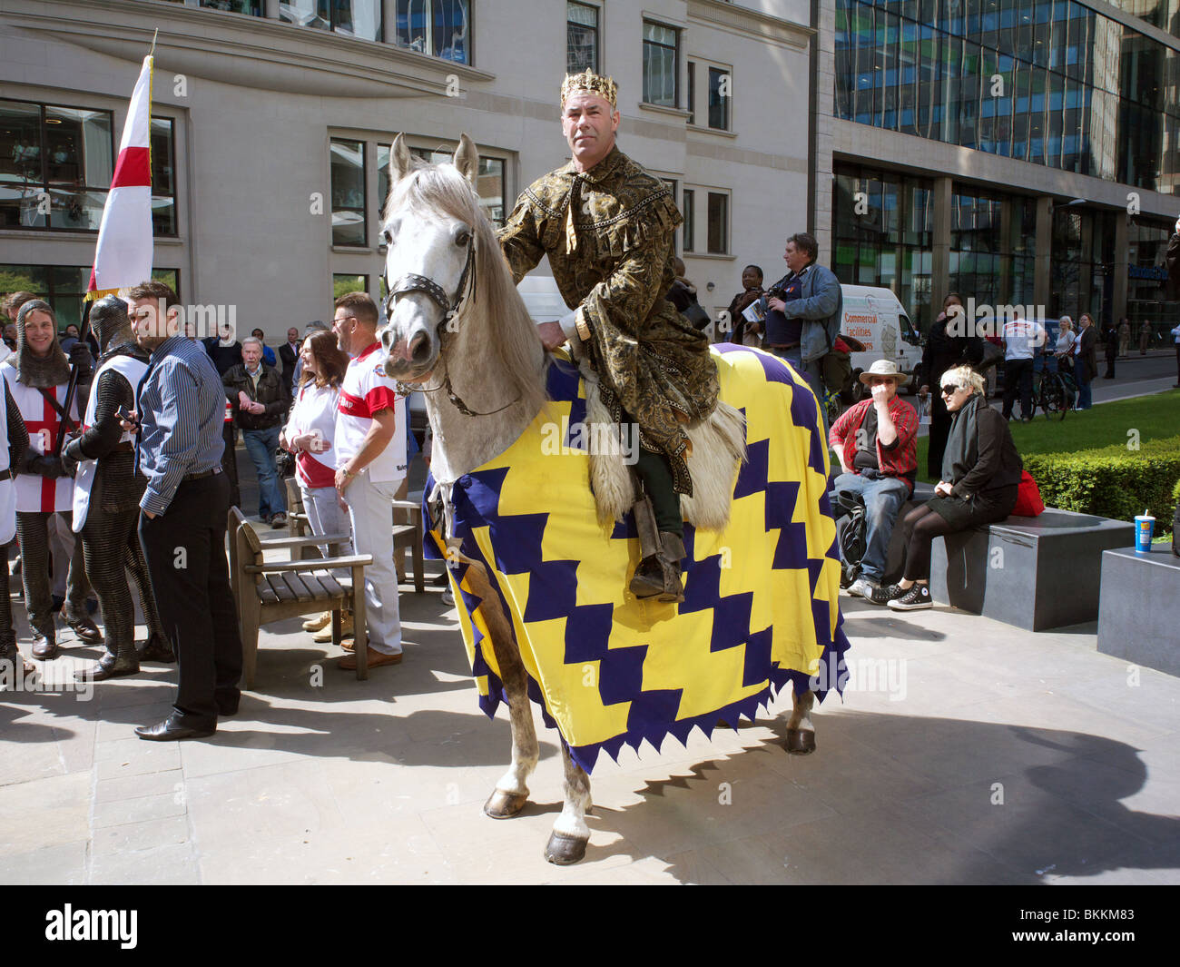 A man mounted on a horse dressed as a medieval King at a St Georges Day ...
