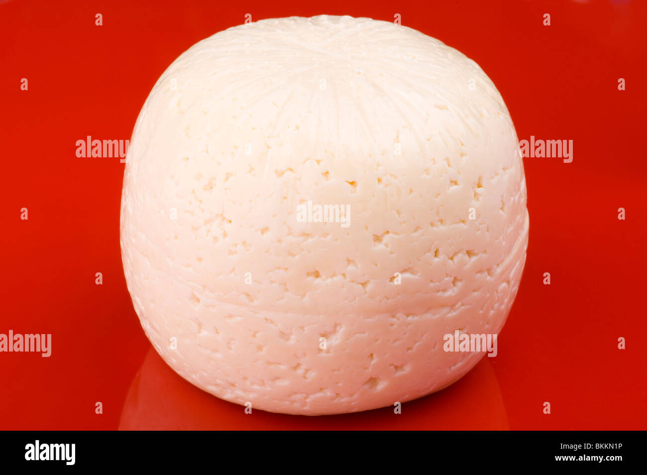 object on red - food cheese close up Stock Photo - Alamy