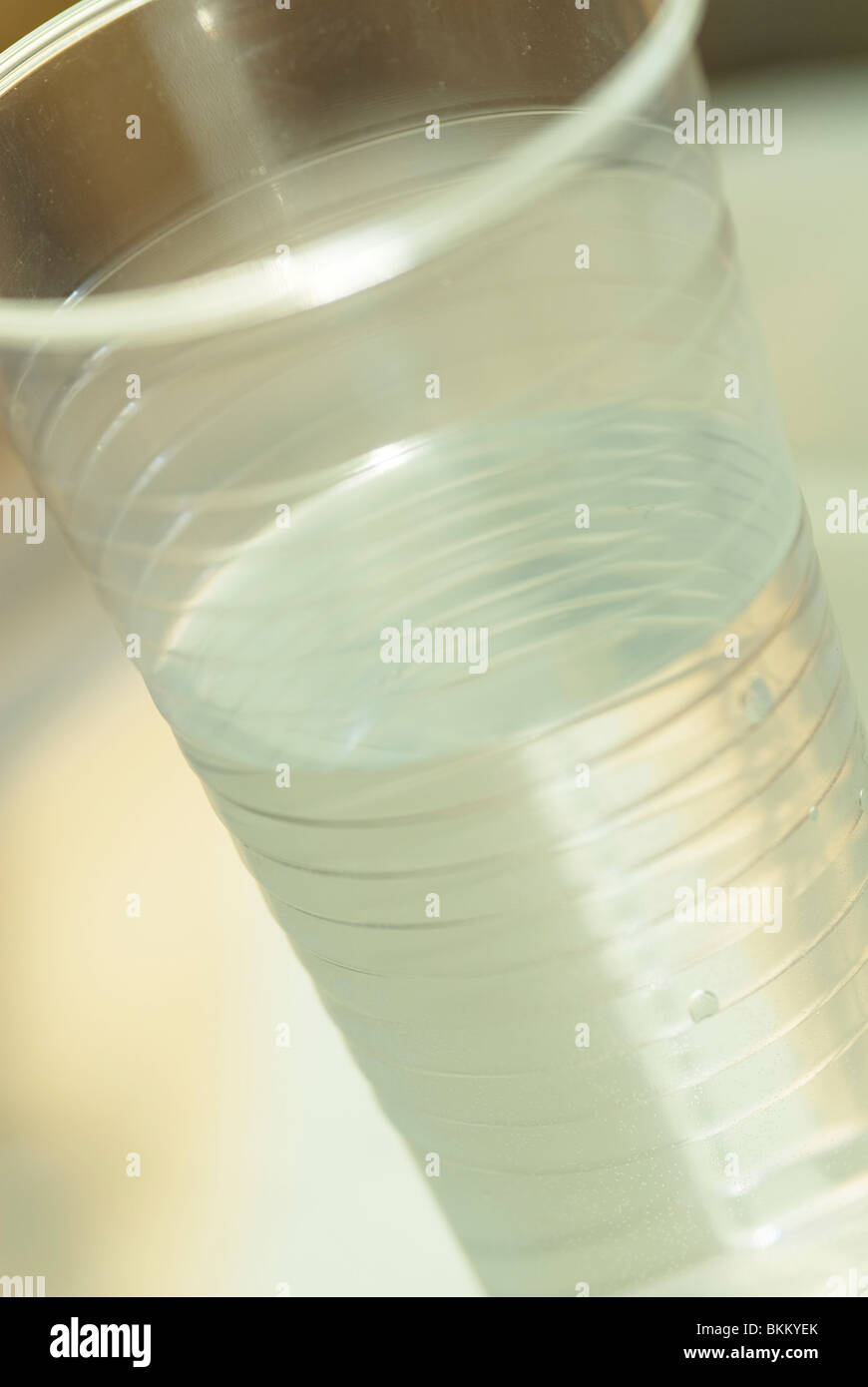 a plastic cup of water shot at an angle Stock Photo - Alamy