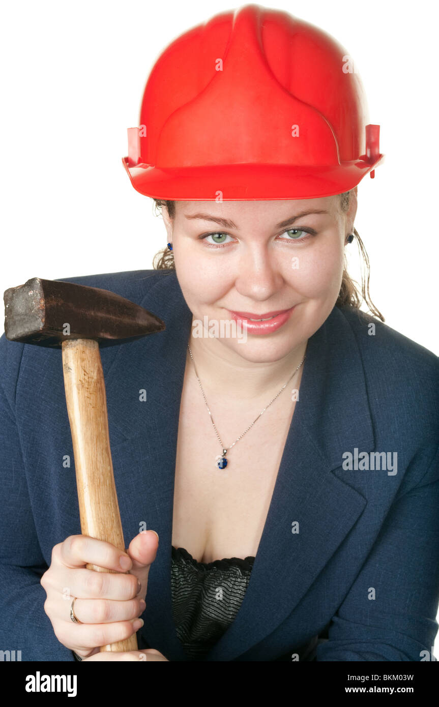 The young beautiful girl with a hammer in hands. It is isolated on a ...