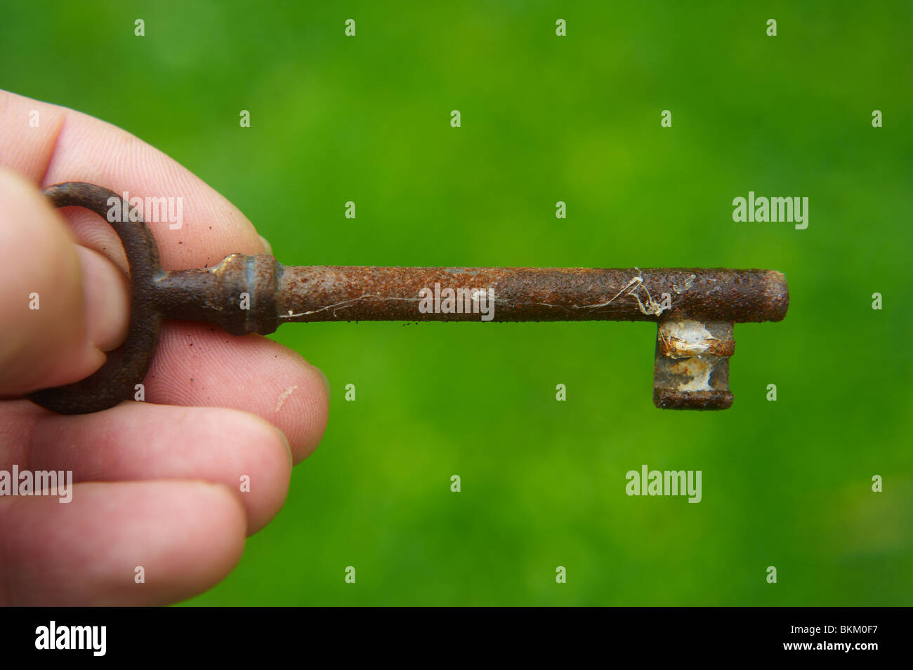 Old rusty key in open hand Stock Photo - Alamy