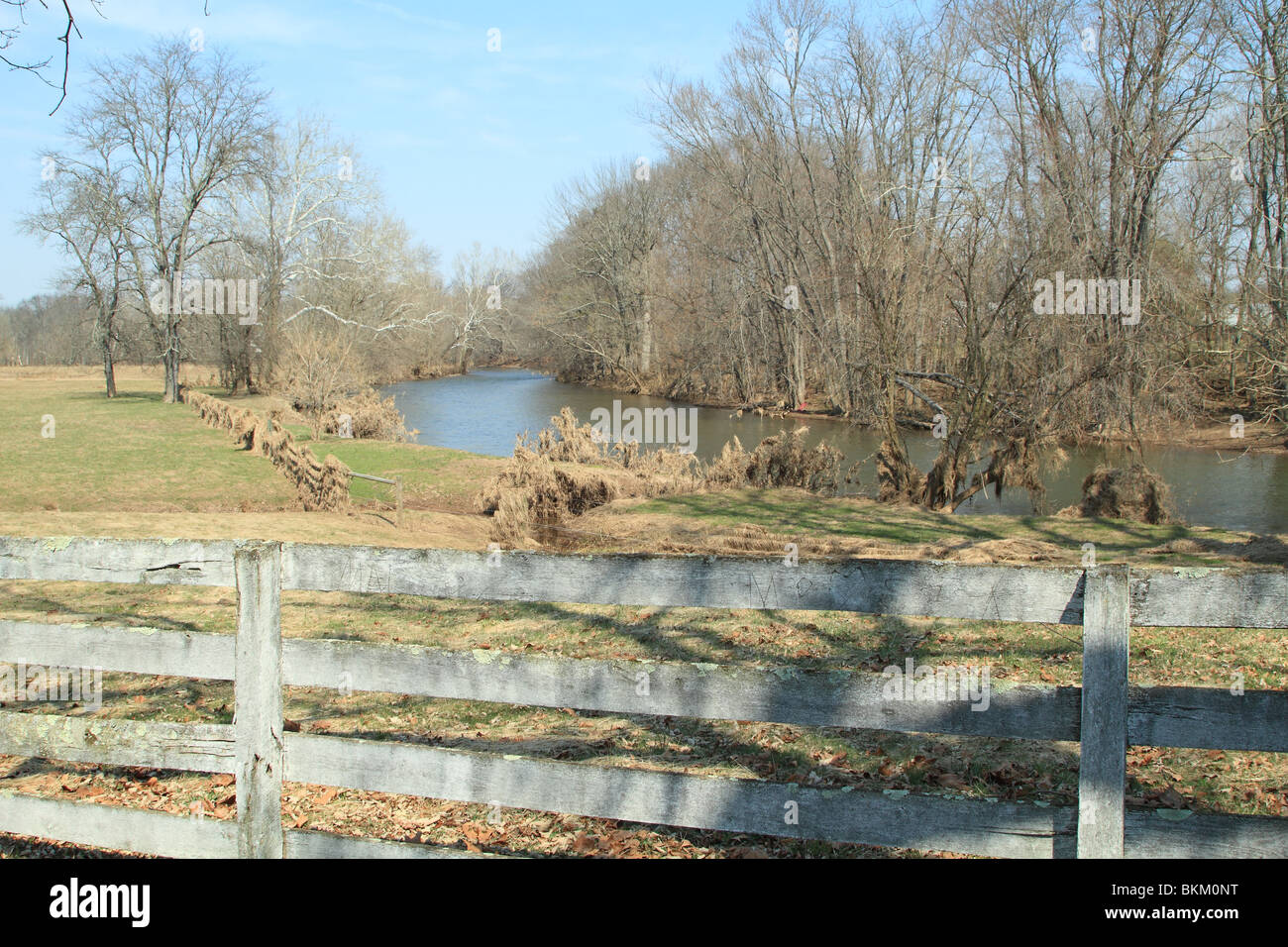 Fence and river Stock Photo - Alamy