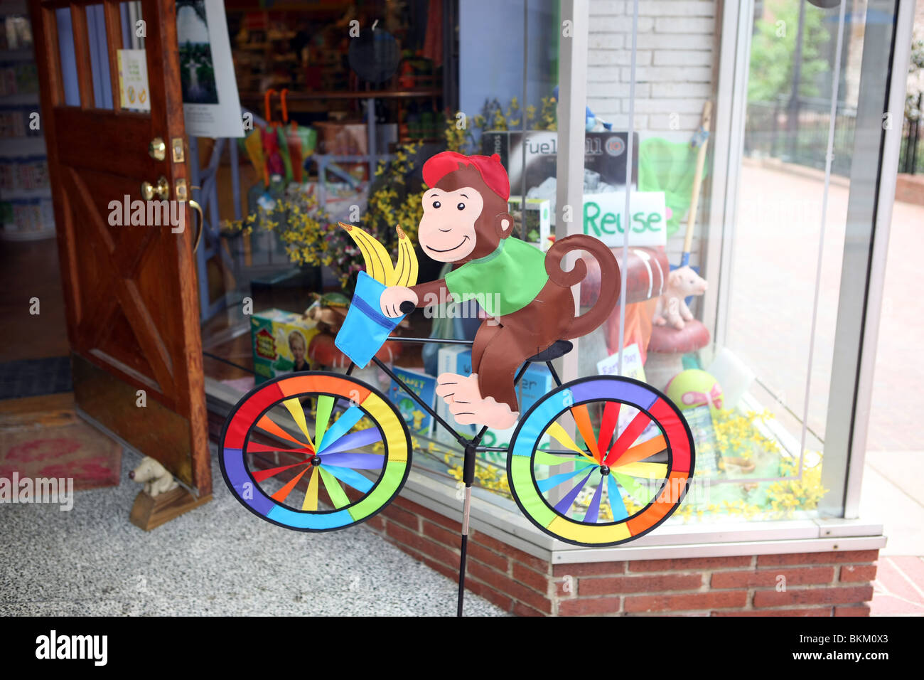 A monkey sits atop a toy windsock in front of Alakazm's toy store in ...