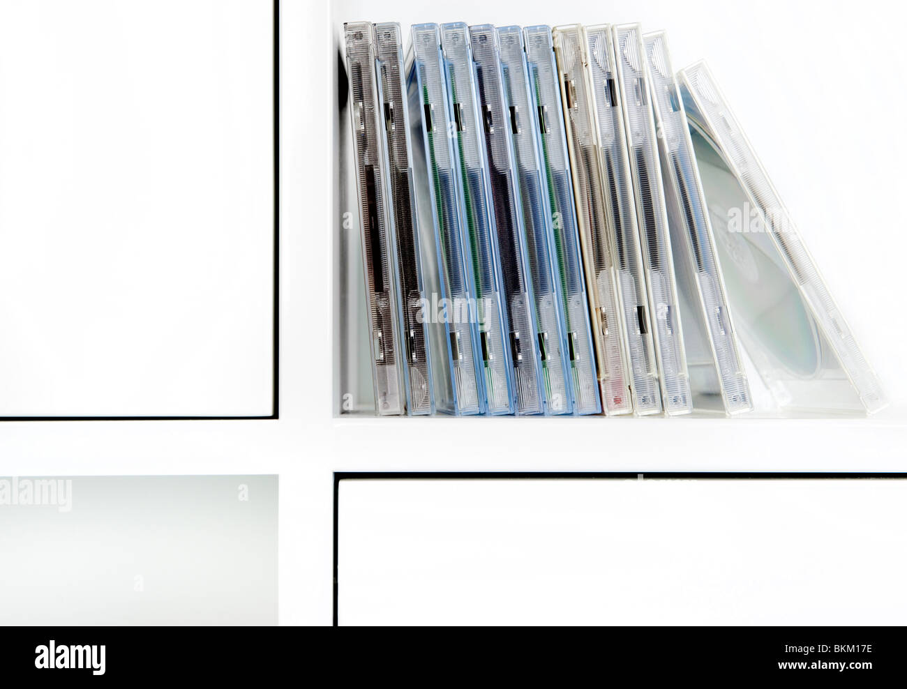 Compact disks on high key shelf Stock Photo - Alamy