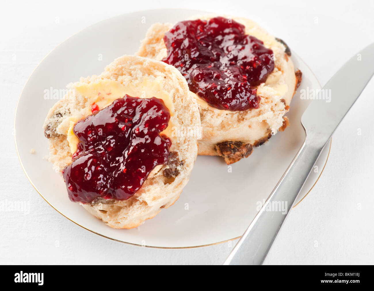 Jam covered scones Stock Photo - Alamy