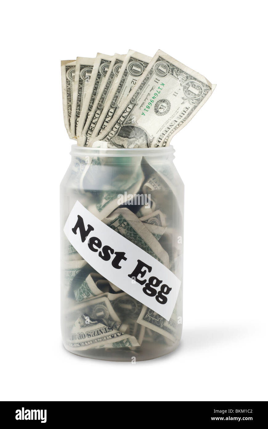 Cash jar overflowing with US Dollar Bills and sign saying "Nest Egg ...