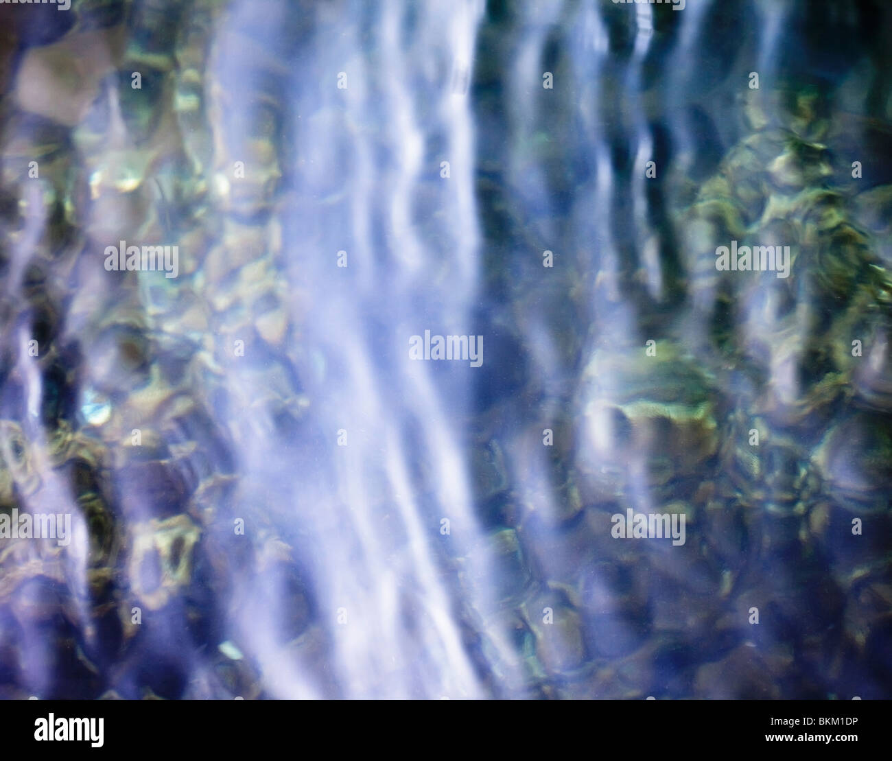 rock bottom through rippling water Stock Photo - Alamy