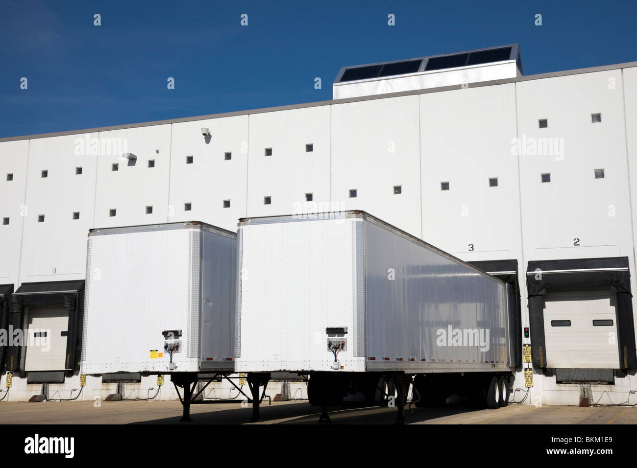 Loading docks under blue sky Stock Photo - Alamy