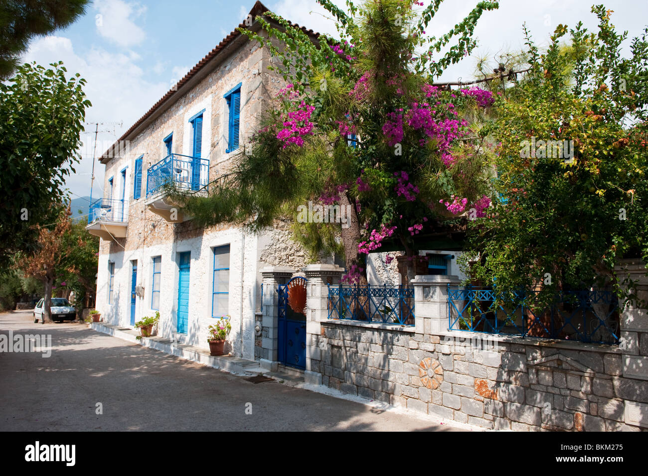 Greek residential with blue blinds and doors Stock Photo - Alamy