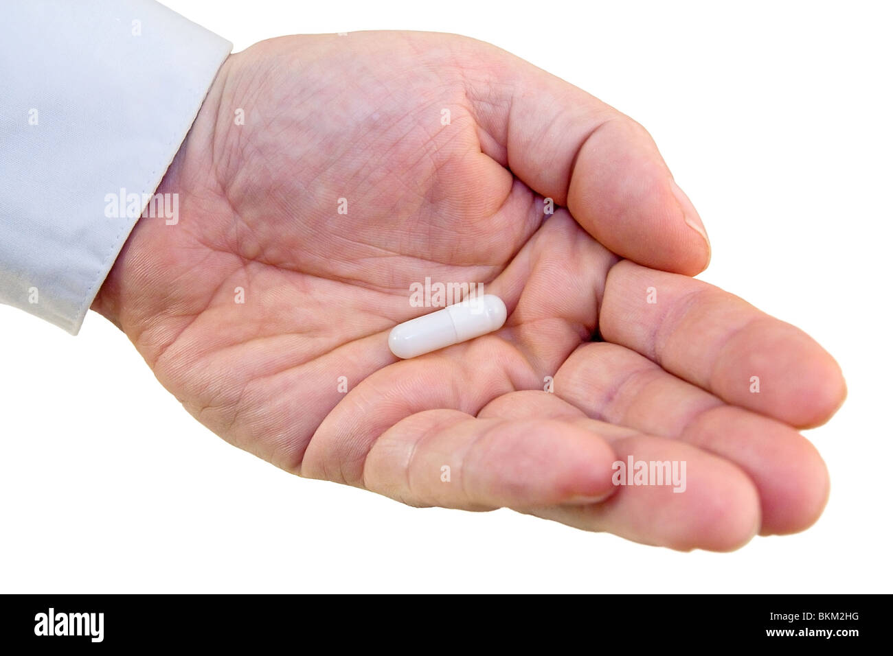 capsule in open hand Stock Photo - Alamy