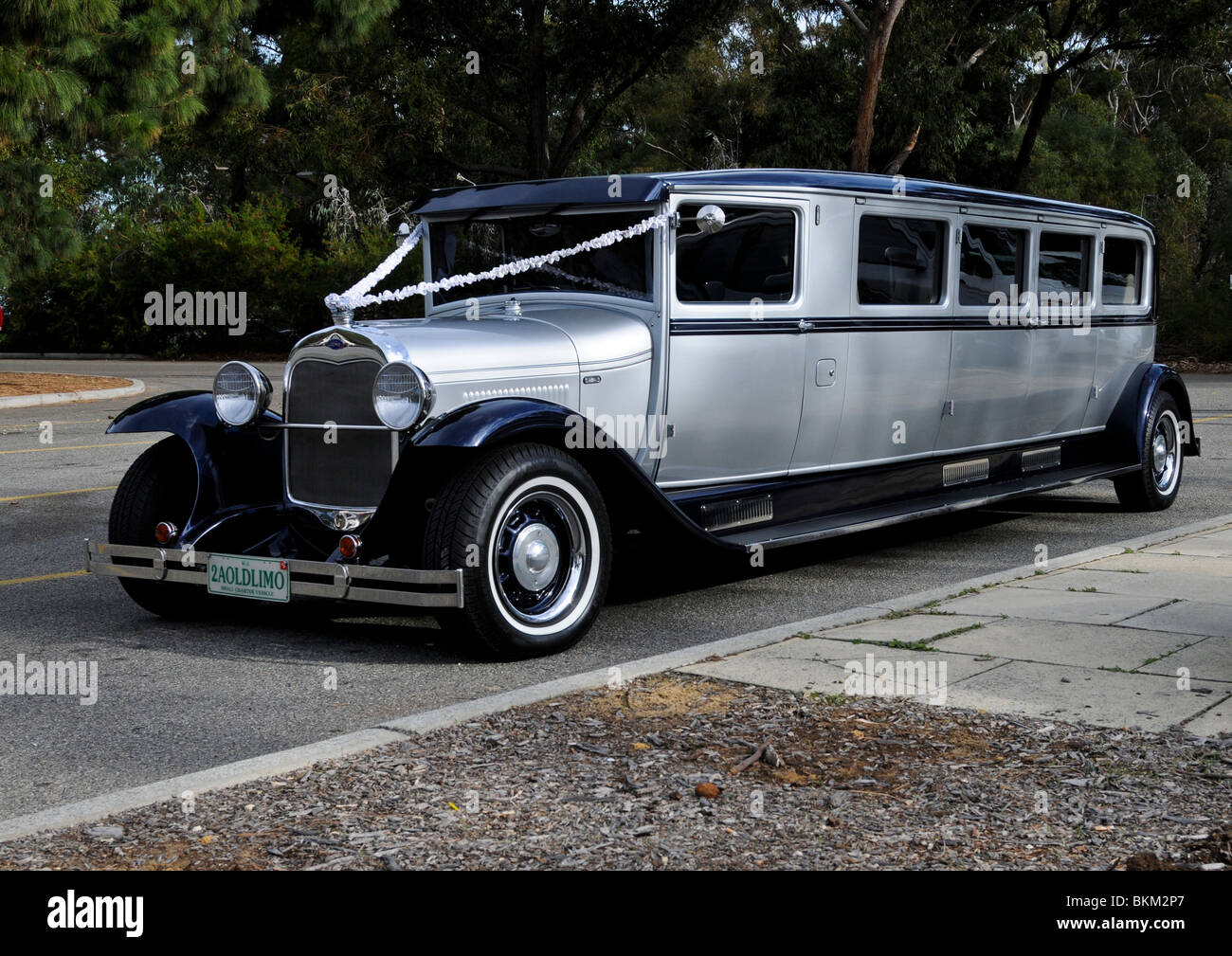 Traditional stretched shining silver limousine hired for wedding ...