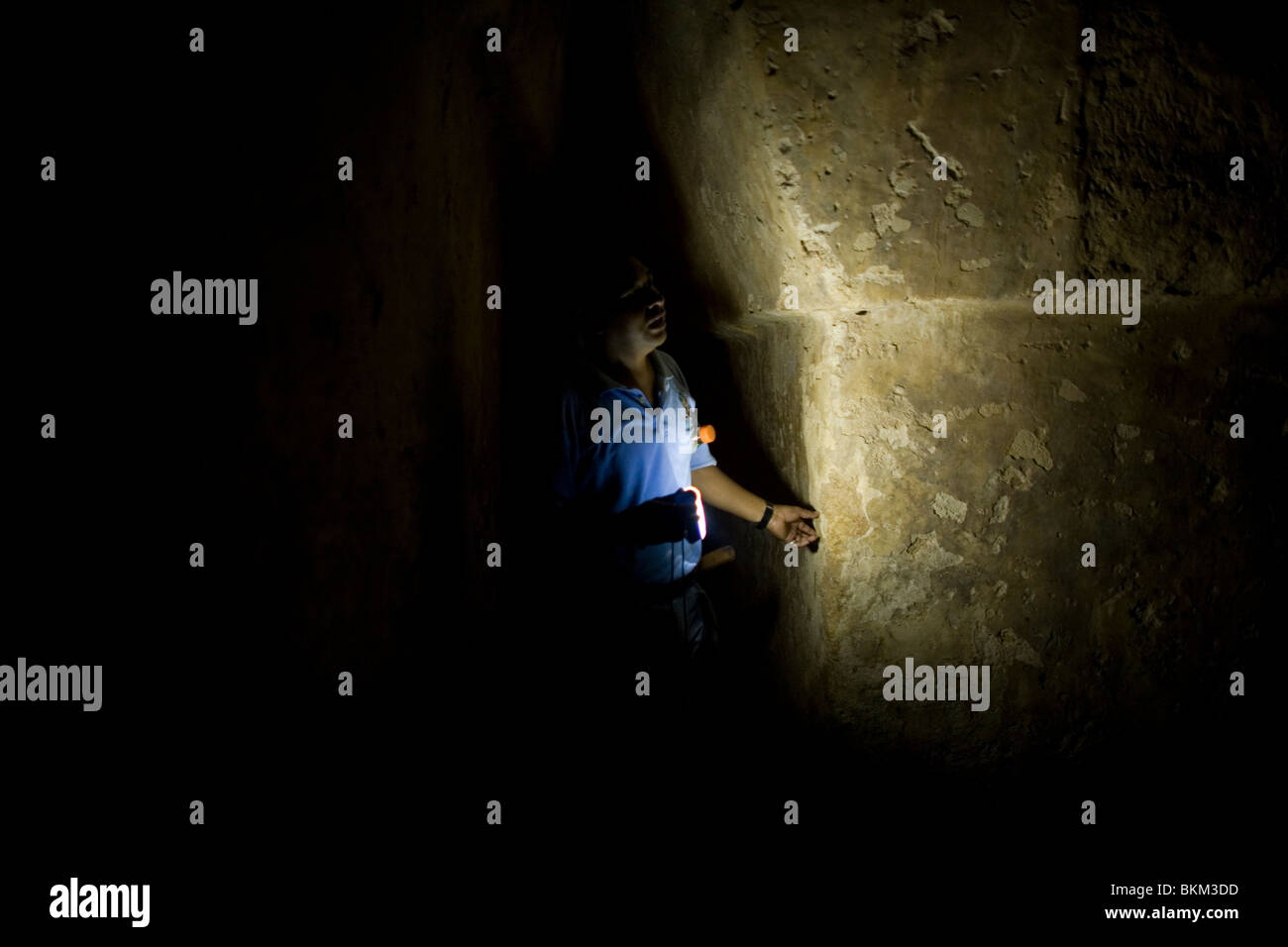 A tour guide shows the Labyrinth in Building 19 at the ancient Mayan ...