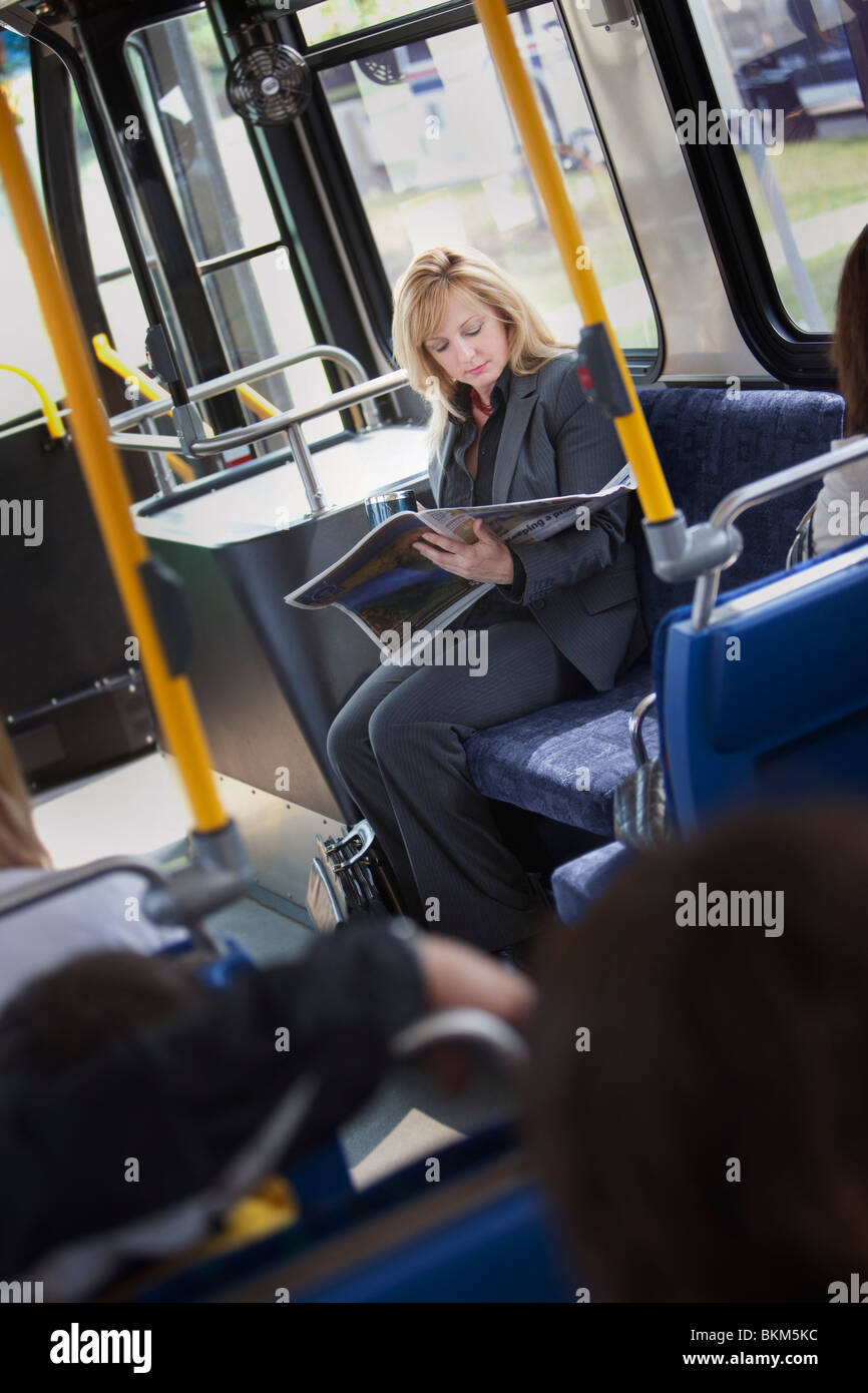 A Woman Sitting On A City Bus Stock Photo - Alamy