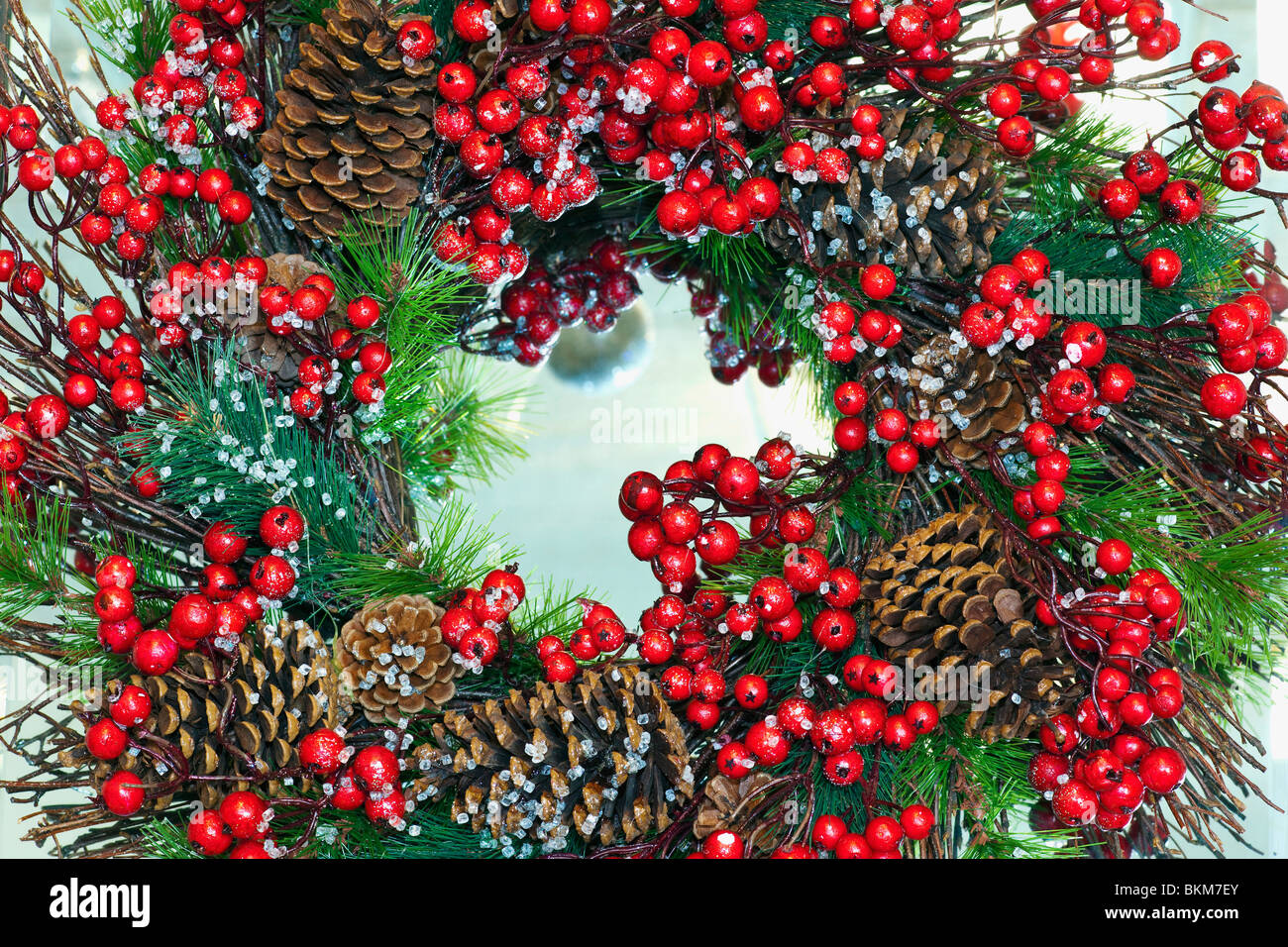 A Christmas Wreath With Cranberries And Pine Cones Stock Photo - Alamy