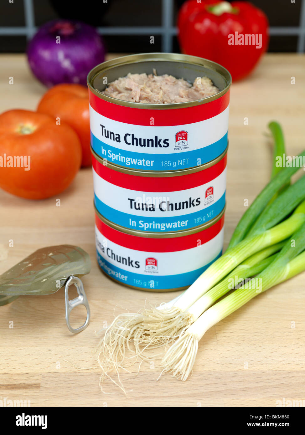 Cans of Tuna isolated on a wooden kitchen bench Stock Photo - Alamy