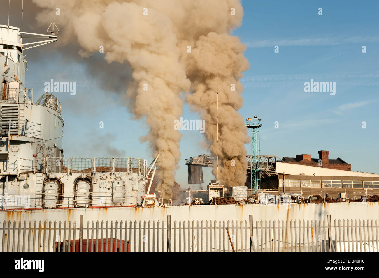 Ex Navy Ship on fire in dock with large volumes of smoke coming from ...