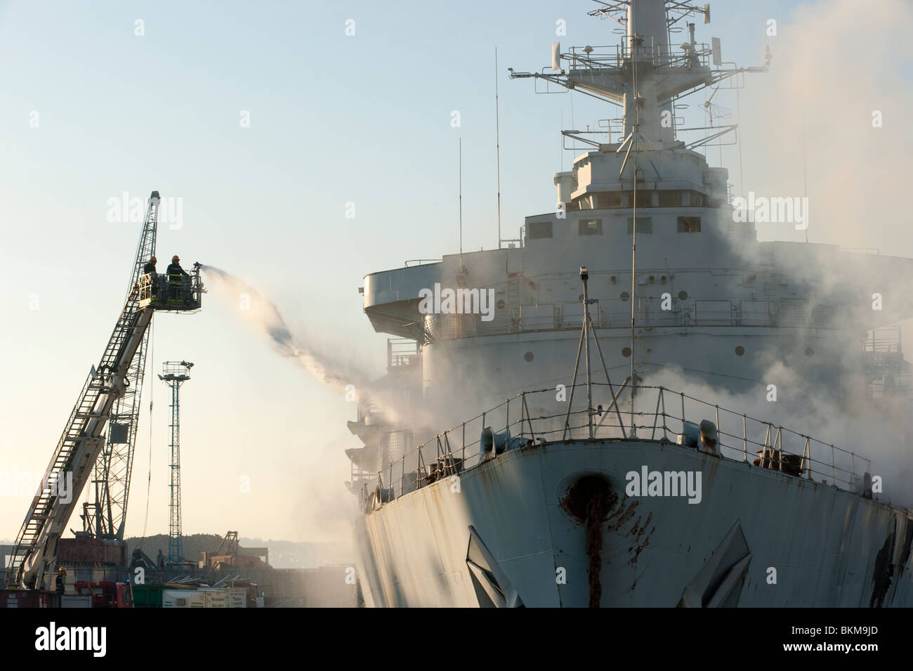 Ex Navy Ship on fire in dock with large volumes of smoke coming from ...