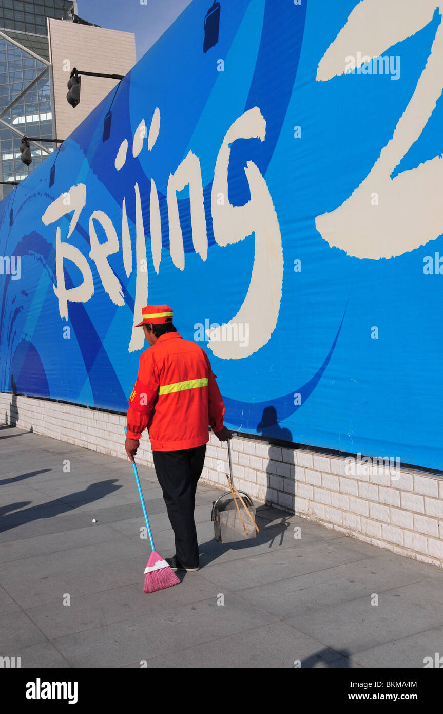 Municipal worker cleaning street downtown Beijing China Stock Photo - Alamy