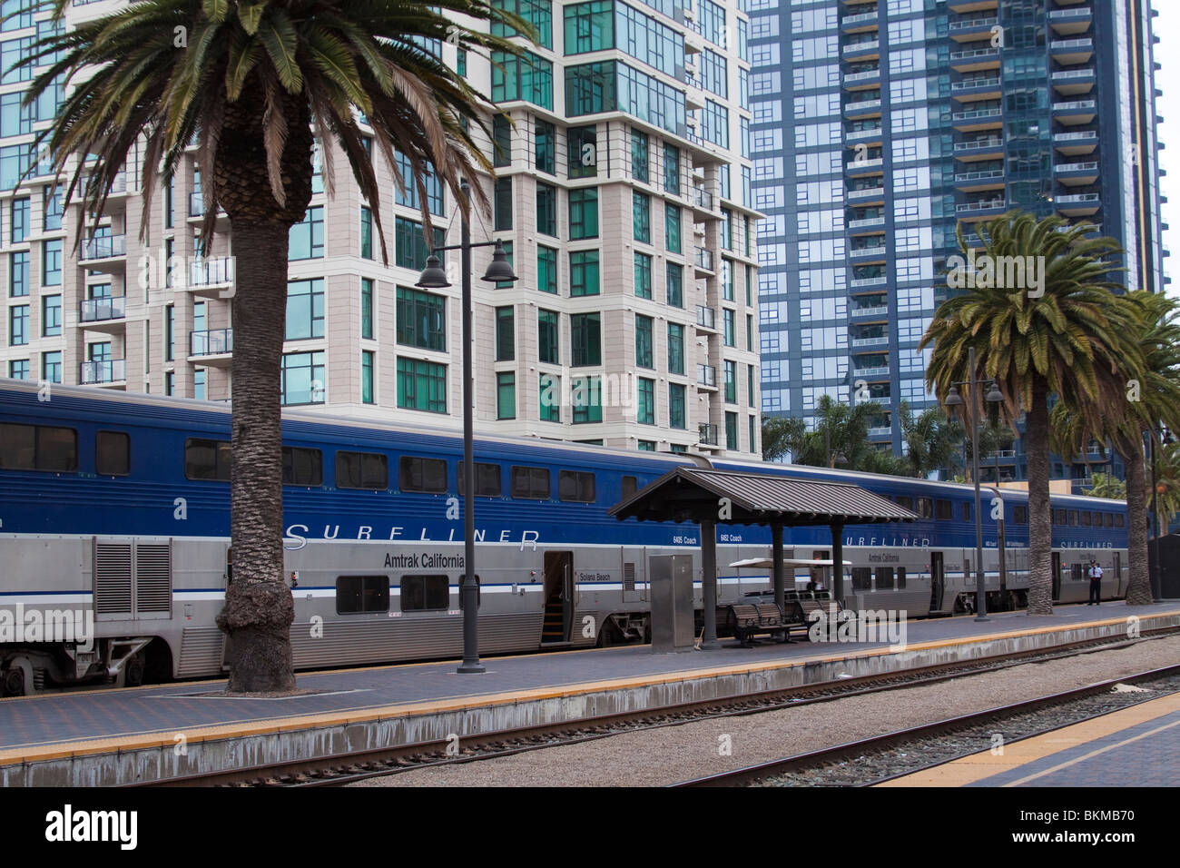 Train at Santa Fe Depot Station with high rise residential buildings ...