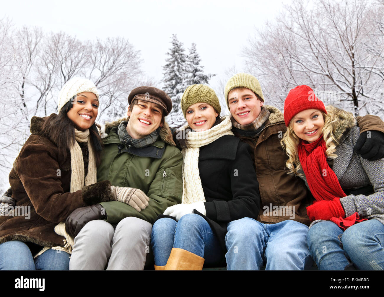 Group of diverse young friends outdoors in winter Stock Photo - Alamy