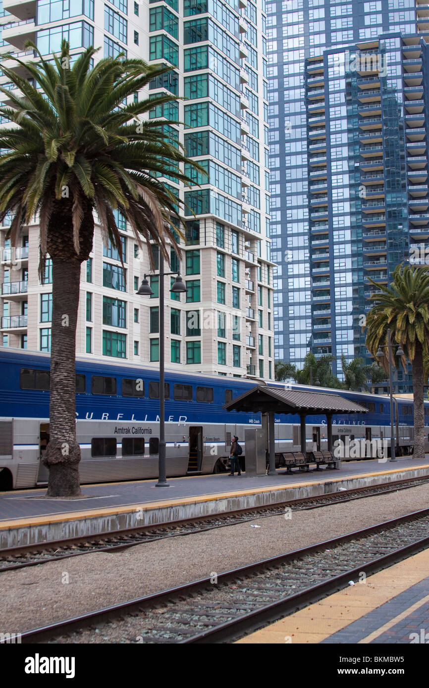 Train at Santa Fe Depot Station with high rise residential buildings ...