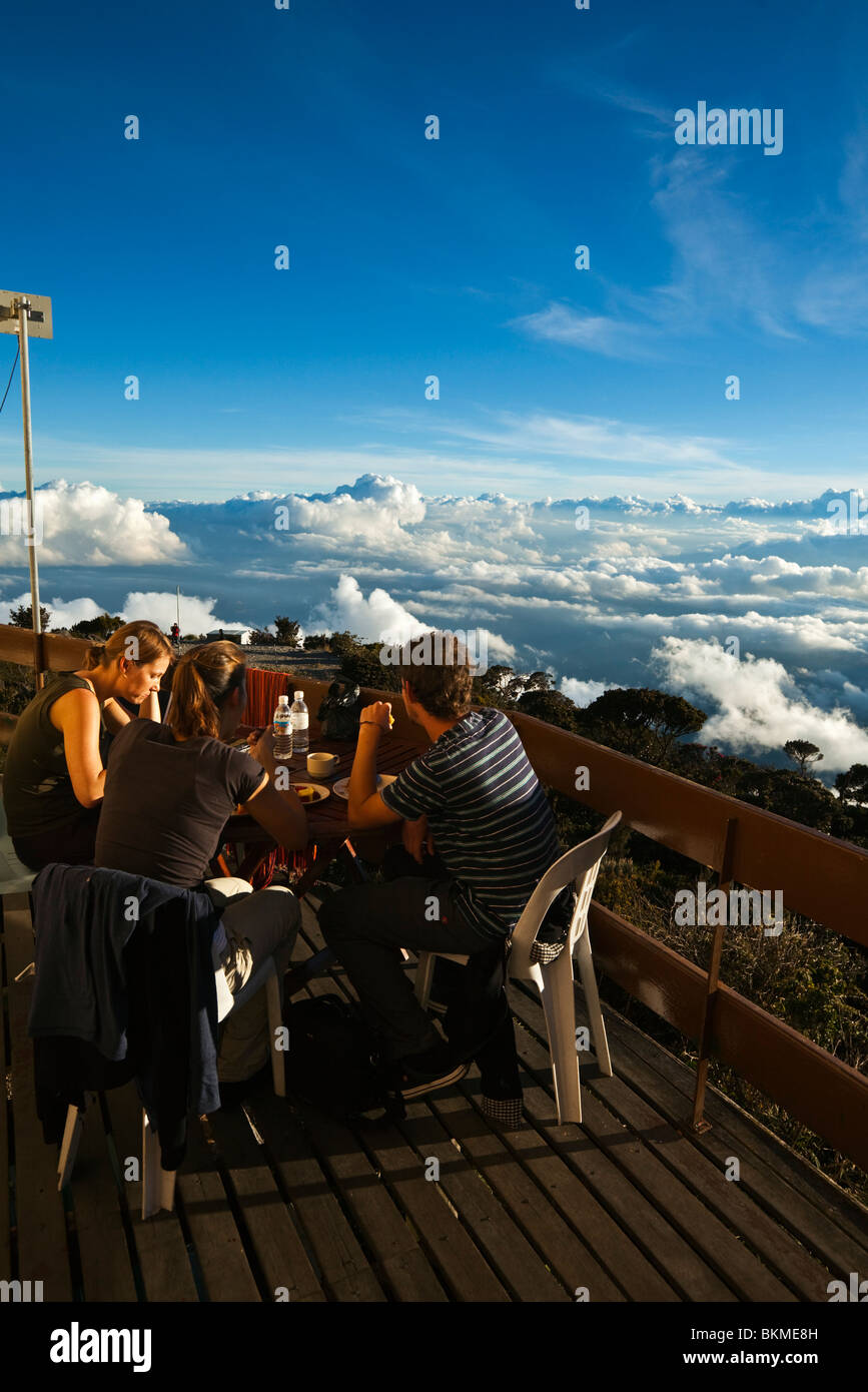 Hikers enjoy lunch above the clouds at Laban Rata resthouse, on Mt ...