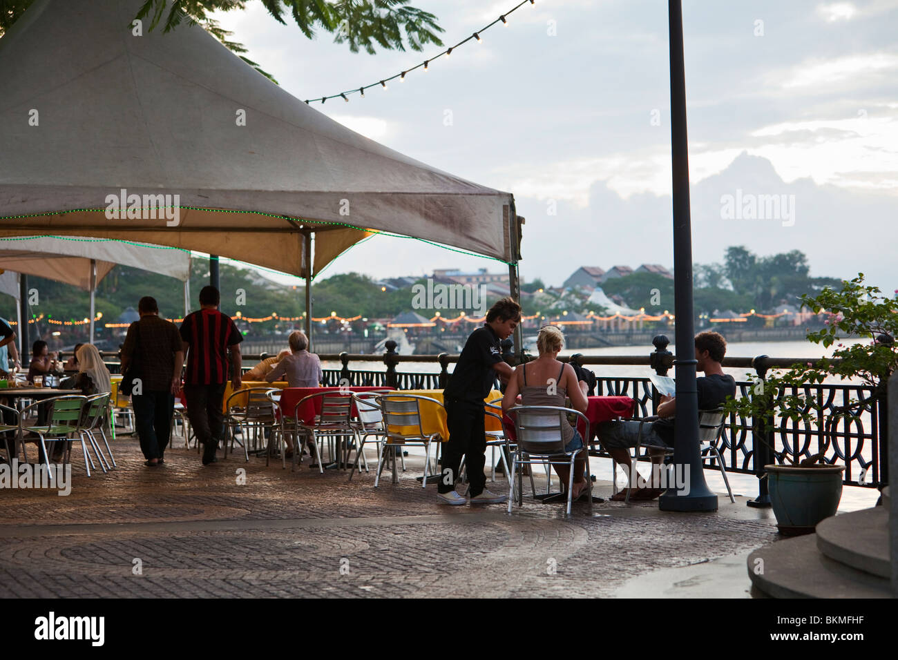 Waterfront dining at food stalls along the promenade. Kuching, Sarawak ...