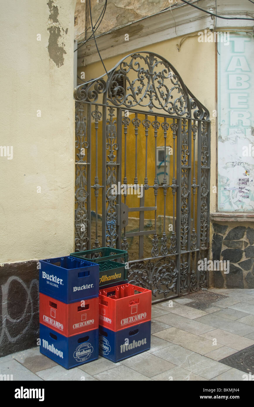 Beer crates outside a fancy gate Stock Photo - Alamy