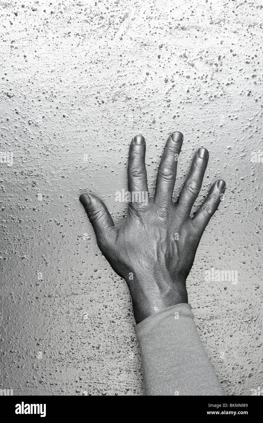 male futuristic man silver hand over textured steel background Stock ...
