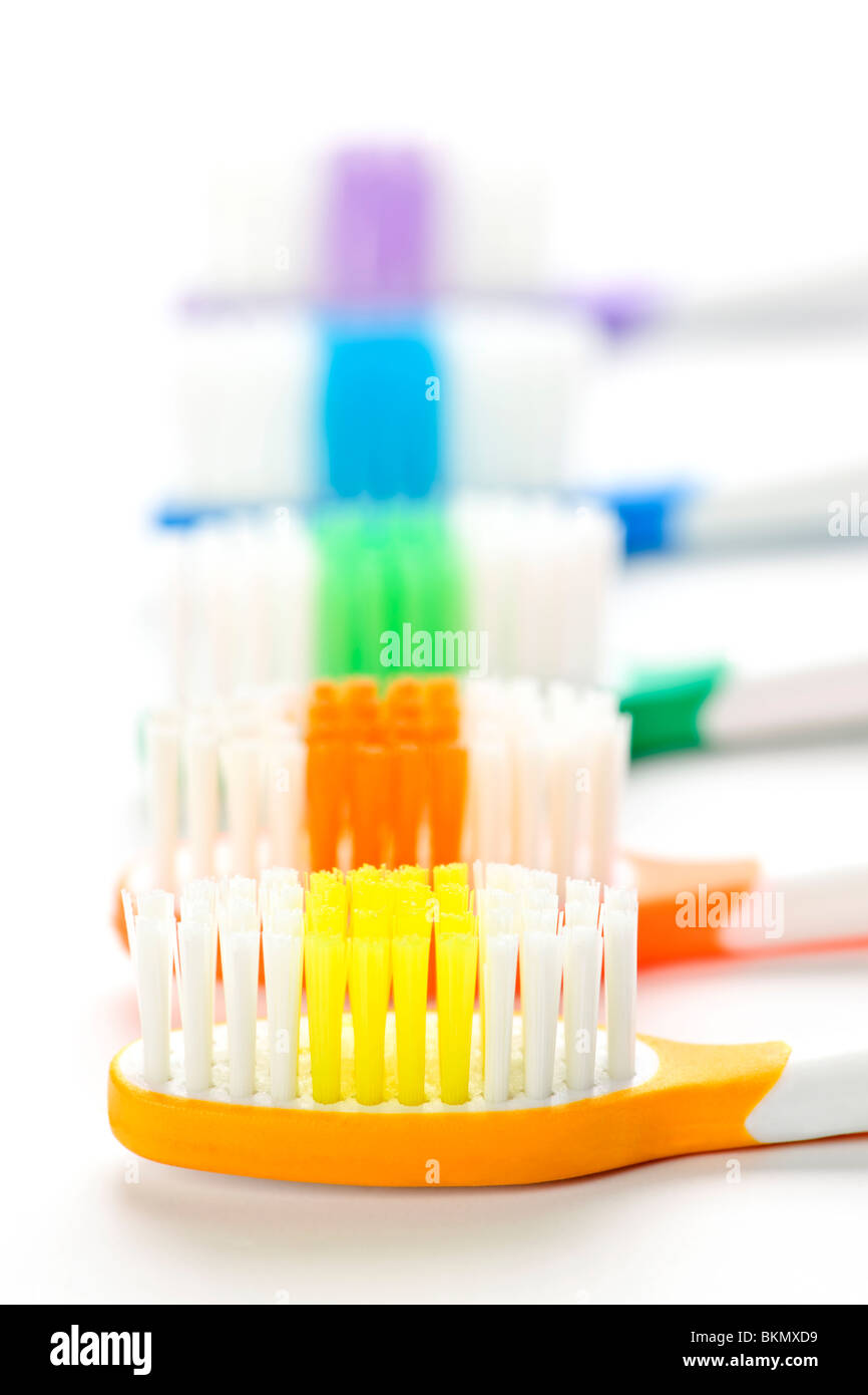 Close up of multicolored toothbrushes on white background Stock Photo ...