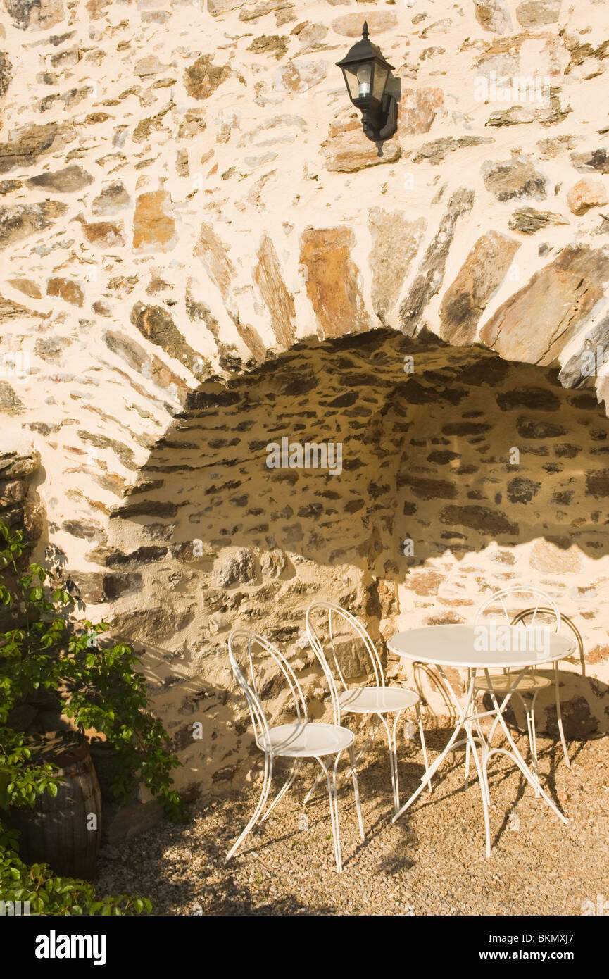 A Sheltered Stone Arched Alcove with Picnic Table and Chairs in a Sunny ...