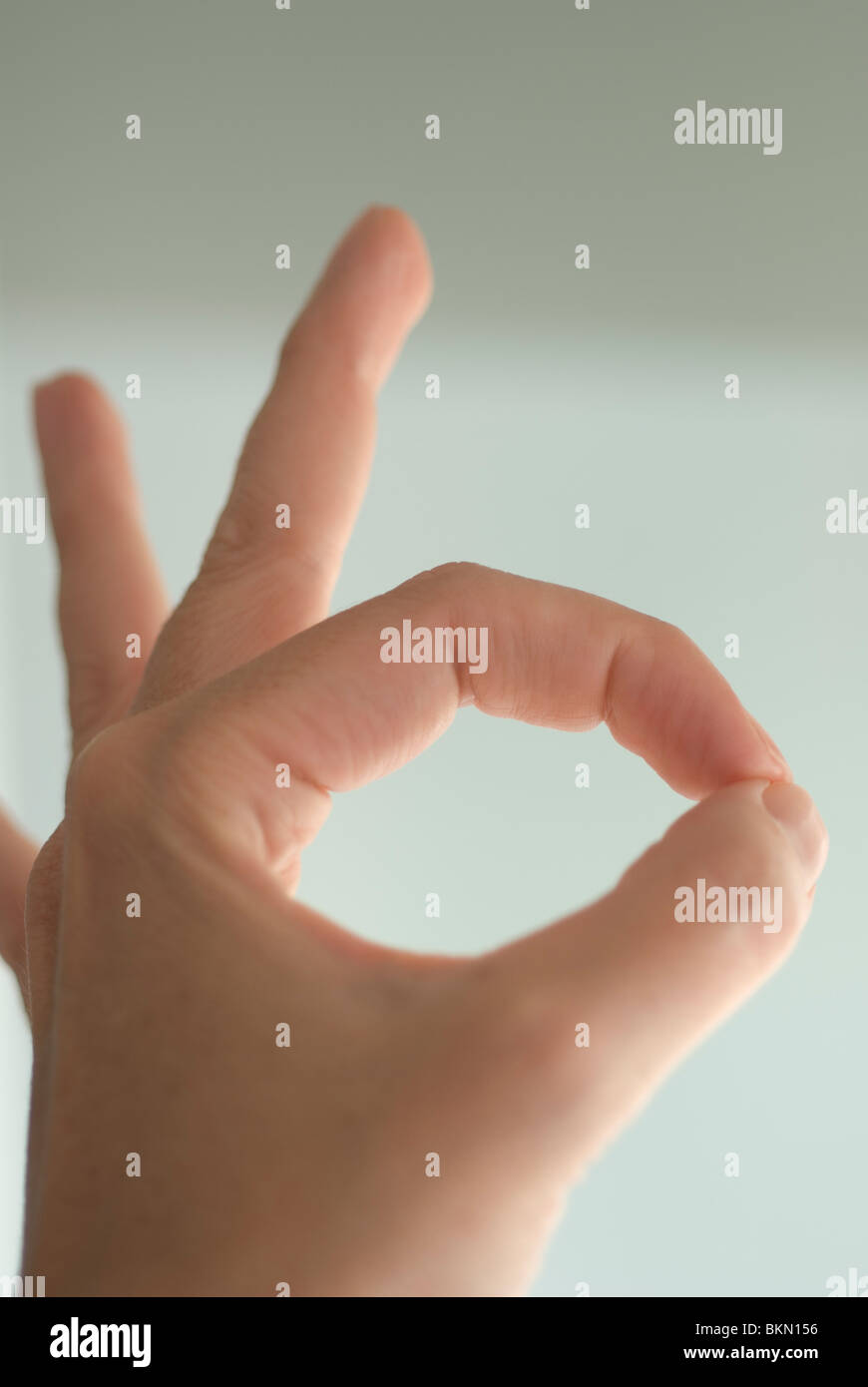 woman makes OK sign by hand Stock Photo - Alamy