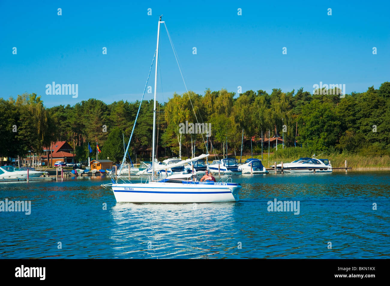 Sailing yacht in front of marina on Jabelscher See, lake near Muritz ...