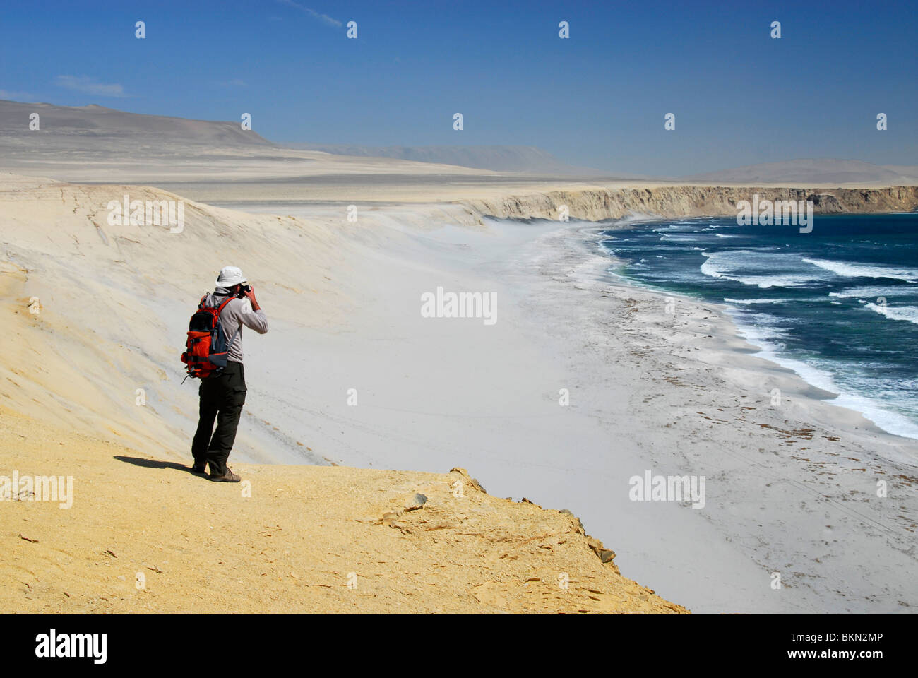 Tourist taking photos in Paracas National Park, Peru, South America ...