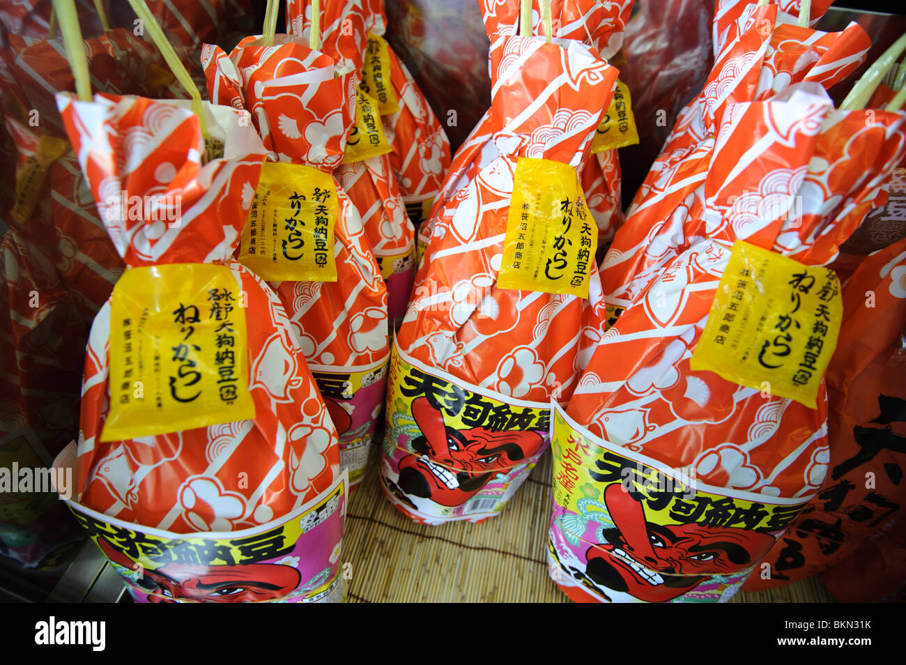 Straw wrapped natto in paper showing a tengu goblin logo, Mito Tengu ...