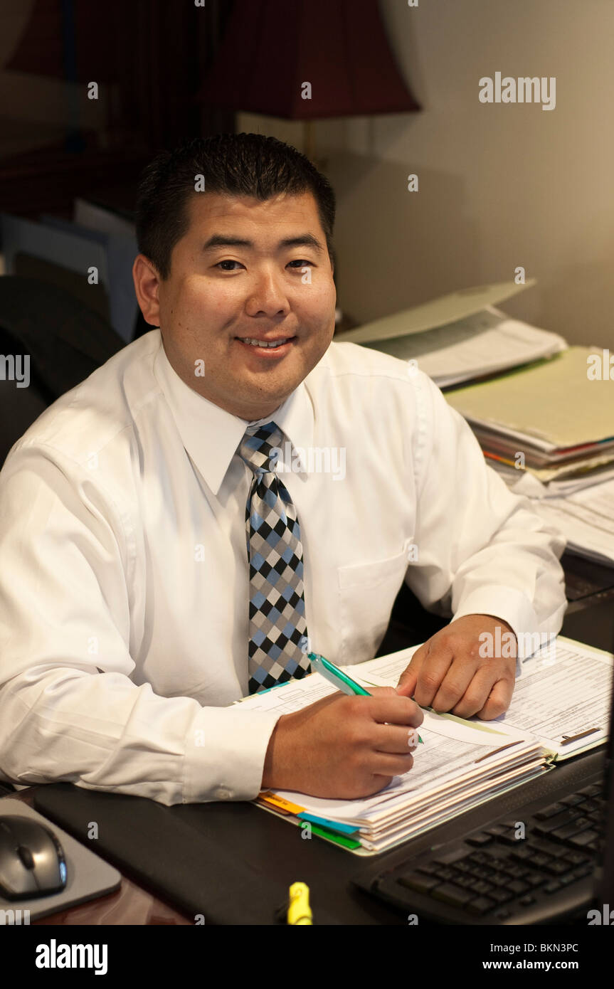 Asian businessman desk in bank hi-res stock photography and images - Alamy