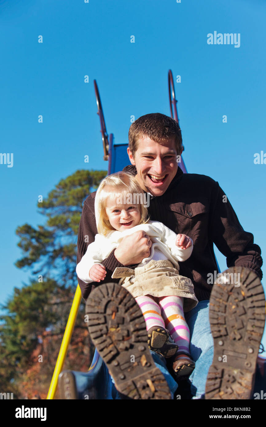 Child going down playground slide hi-res stock photography and images ...