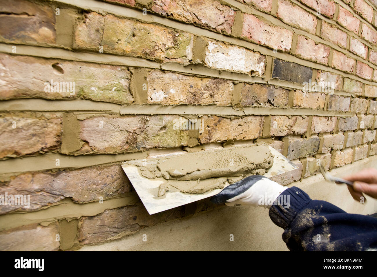 Brick wall being re pointed pointing hi-res stock photography and ...