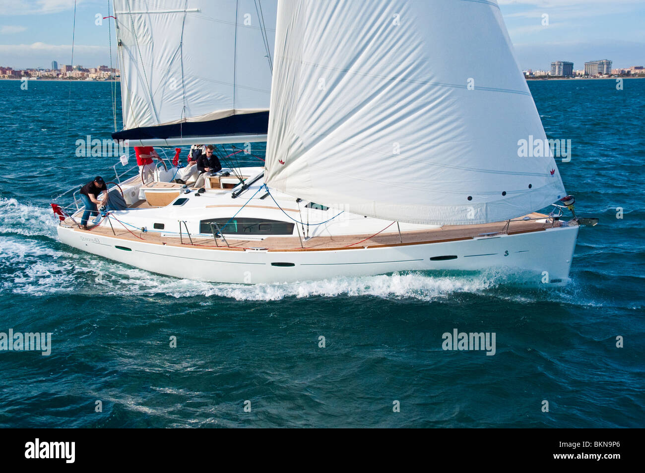 Helmsman or skipper with crew in cockpit of Beneteau Oceanis 43 ...