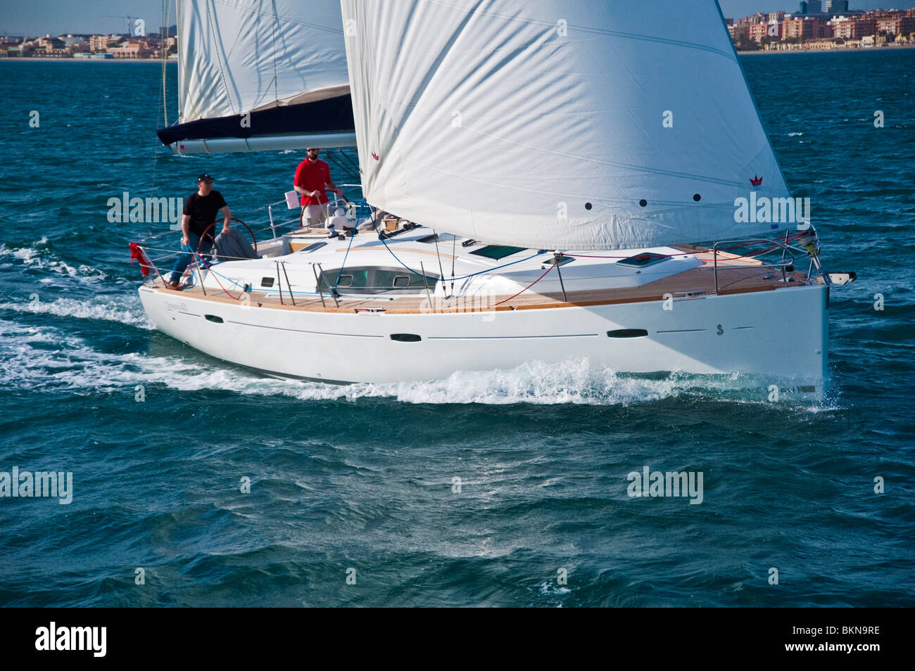 Helmsman or skipper with crew in cockpit of Beneteau Oceanis 43 ...