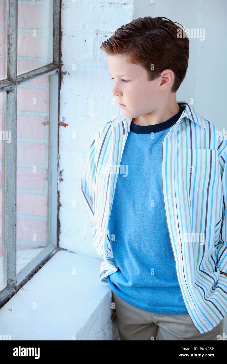 A Boy Watching Out The Window Stock Photo - Alamy