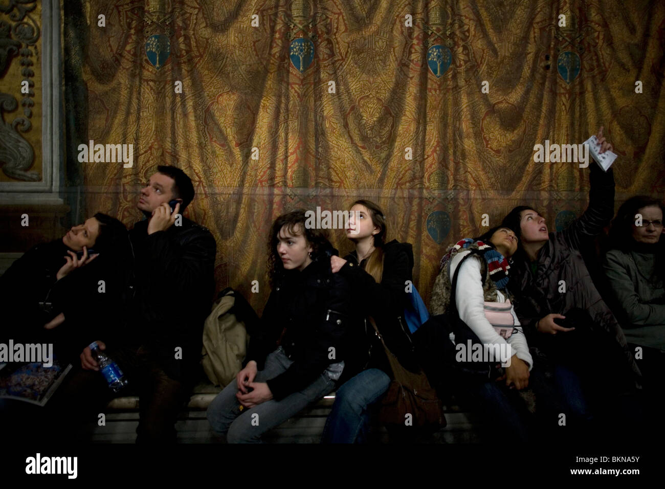 Tourists look at the ceiling of the Sistine Chapel in the Vatican ...