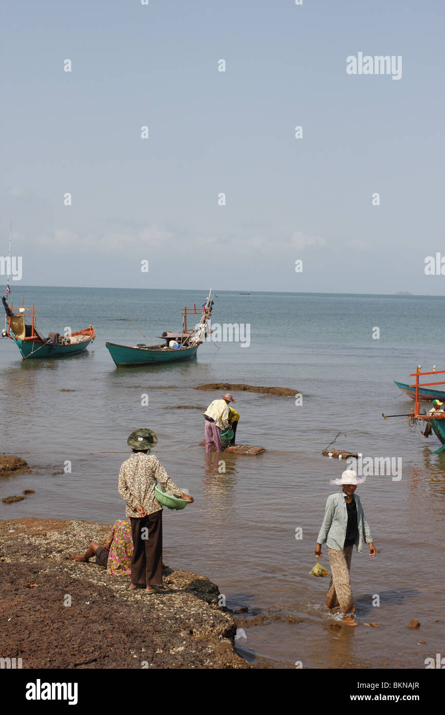 Woman fishing off beach hi-res stock photography and images - Alamy