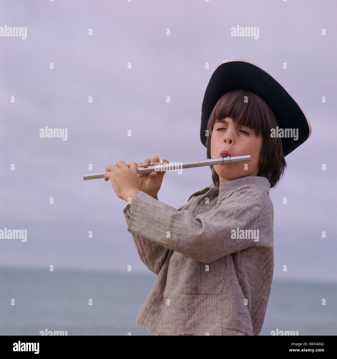 Boy playing a flute hi-res stock photography and images - Alamy