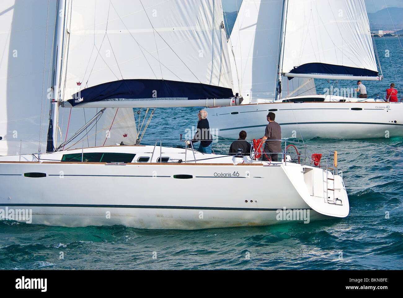 Helmsman or skipper with crew in cockpit of Beneteau Oceanis 40 and 46 ...