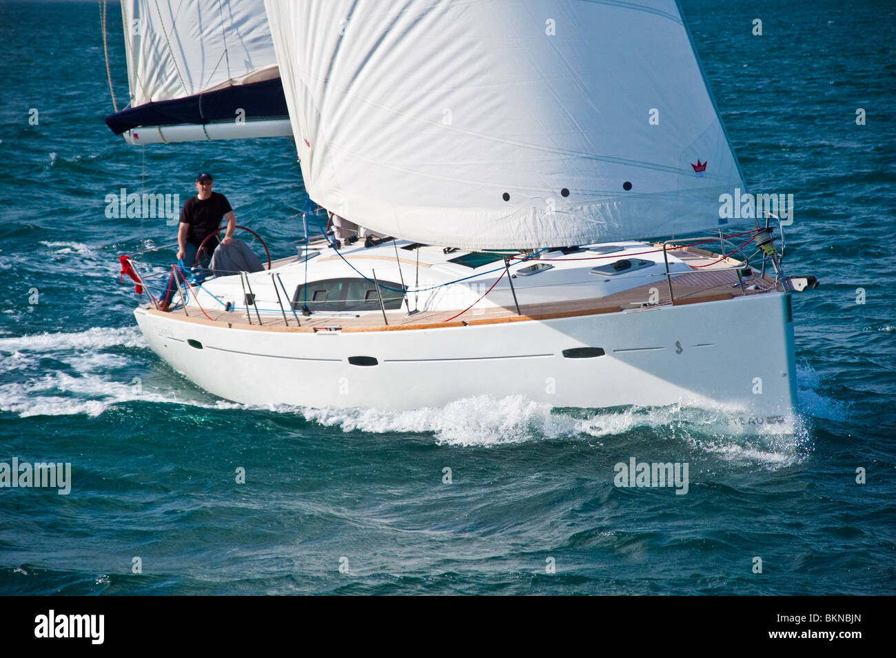 Helmsman or skipper with crew in cockpit of Beneteau Oceanis 43 ...