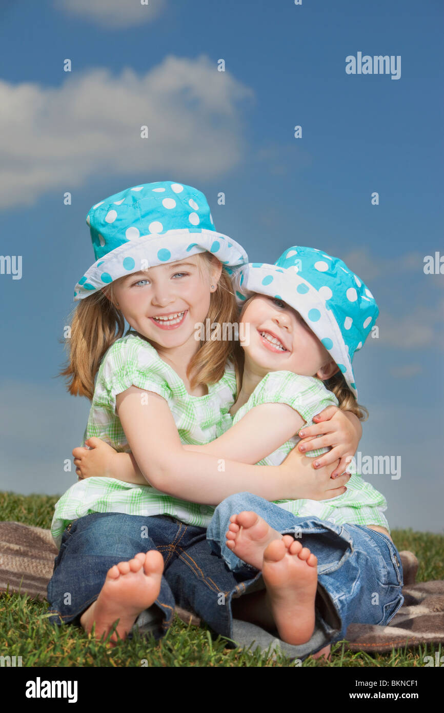 Two Young Girls Hugging Stock Photo - Alamy